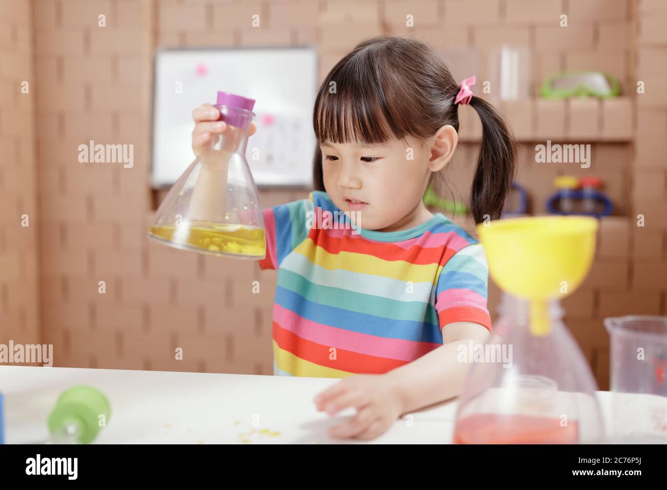 toddler girl play science experiments for homeschooling Stock Photo - Alamy