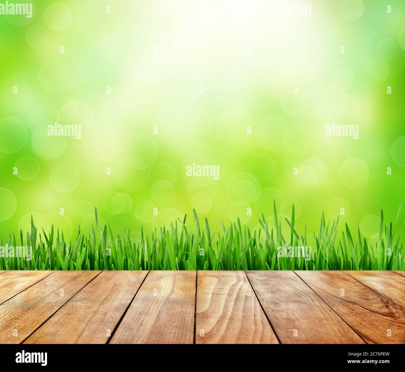 Wooden deck table on green background hi-res stock photography and ...