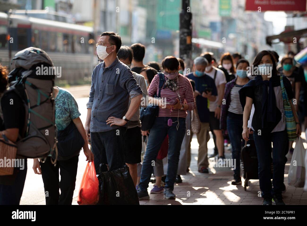 Bus stop queue with face masks hi-res stock photography and images - Alamy