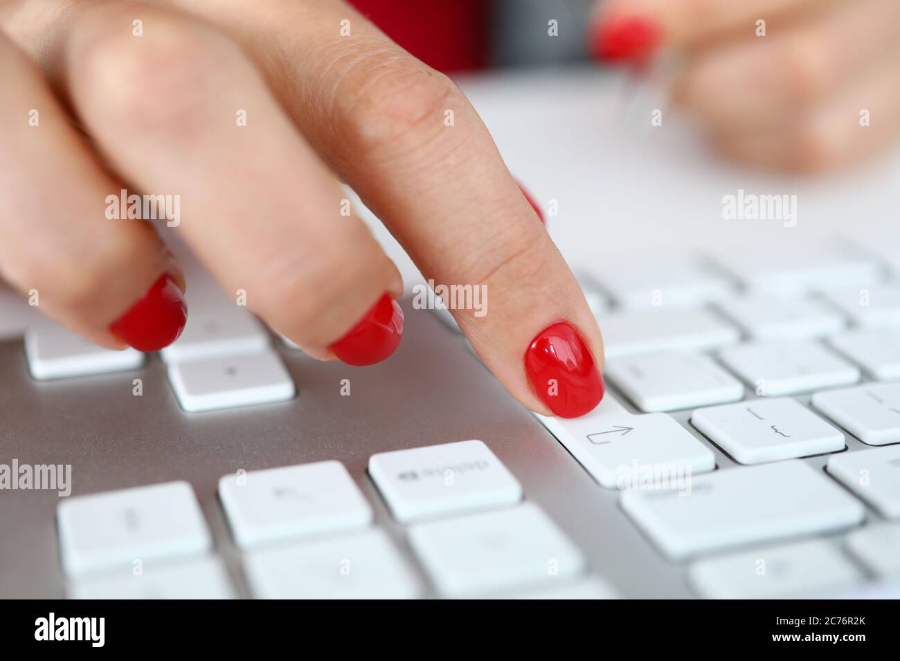 Red nails typing hi-res stock photography and images - Alamy