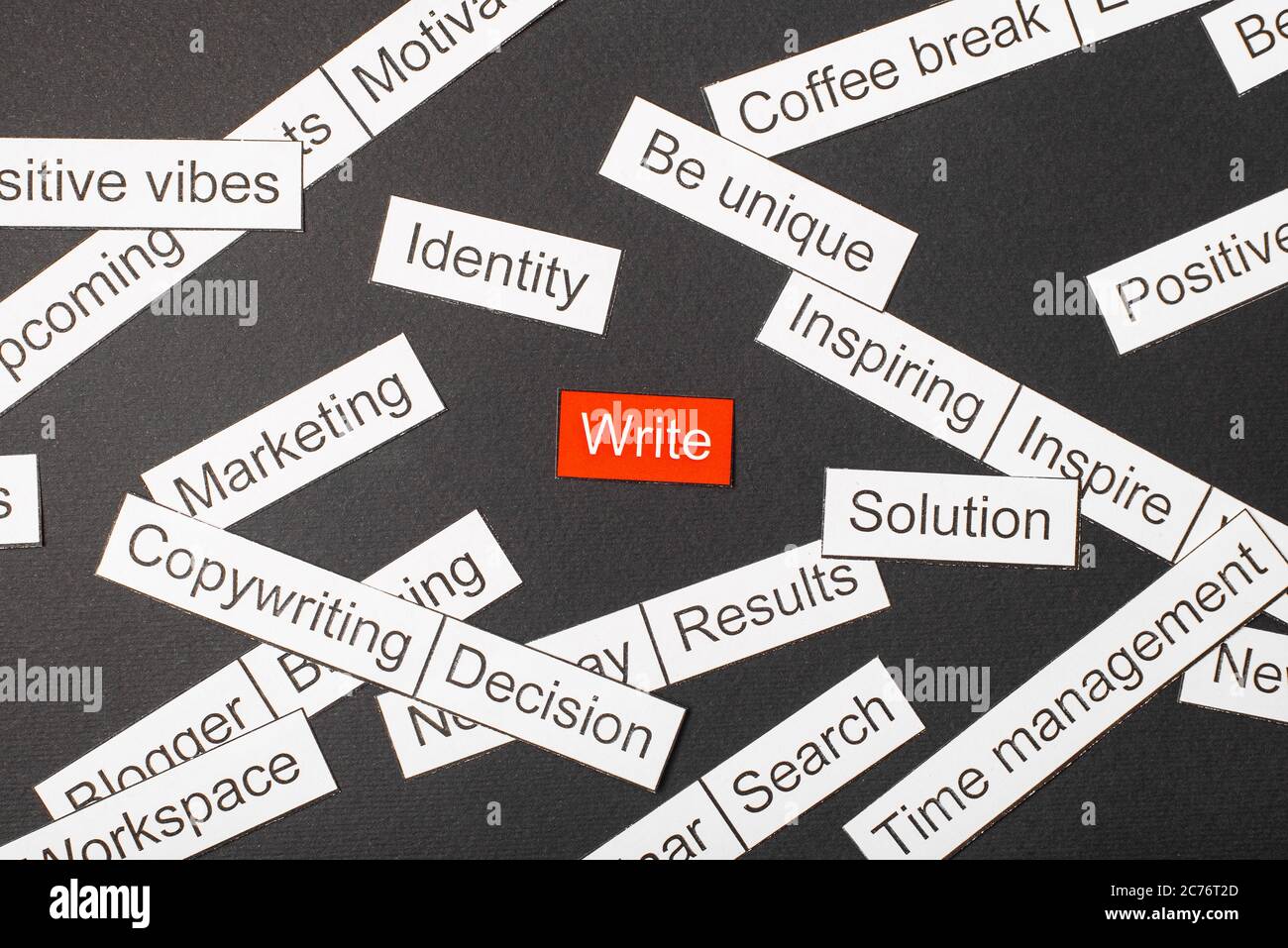 Cut paper inscription write on a red background, surrounded by other ...