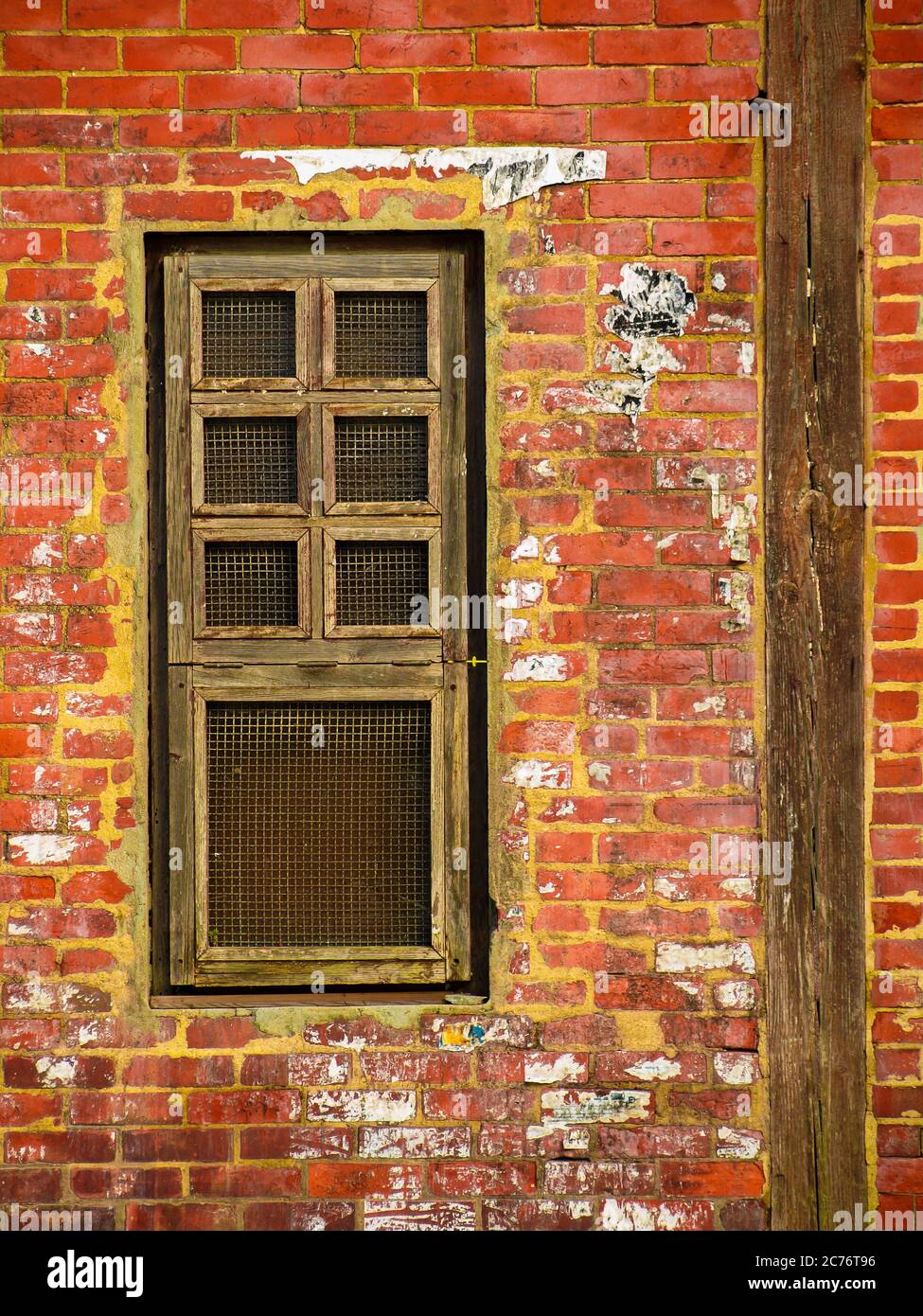 Wooden window in old brick wall Stock Photo - Alamy
