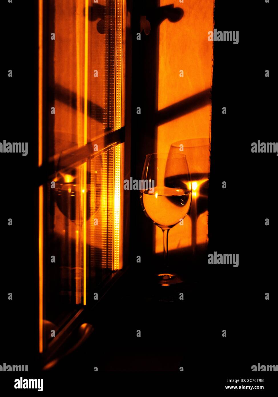 Wine glass on a window sill Stock Photo - Alamy