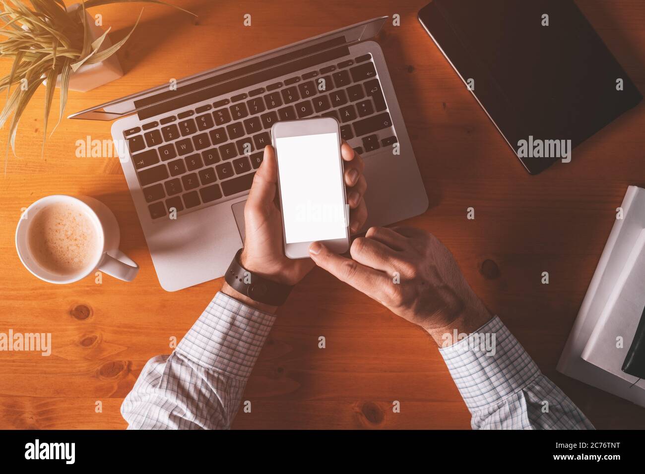 Smartphone mock up overhead shot, businessman holding mobile phone with ...