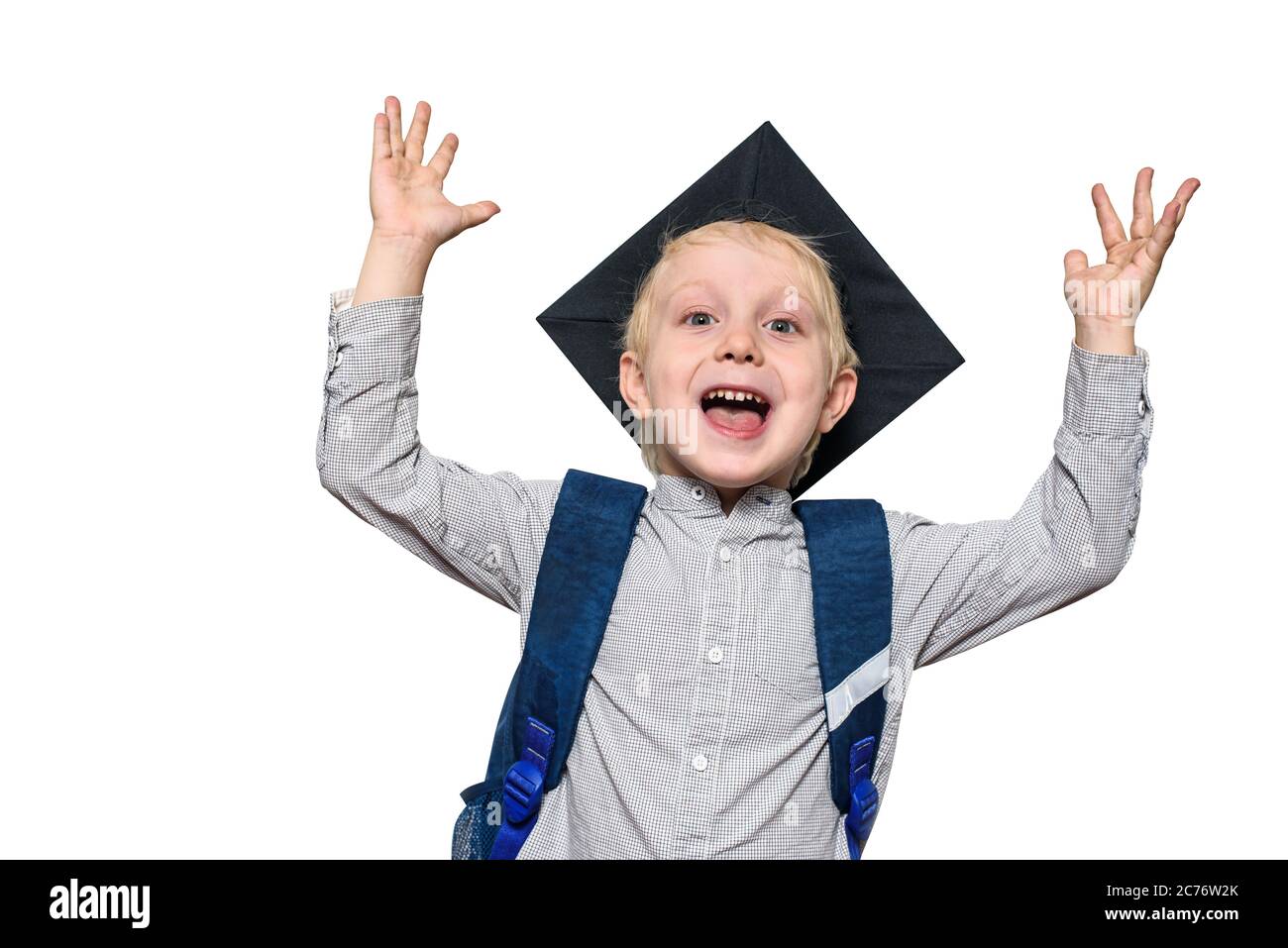 Portrait of a joyful blond boy with academic hat and a school bag ...