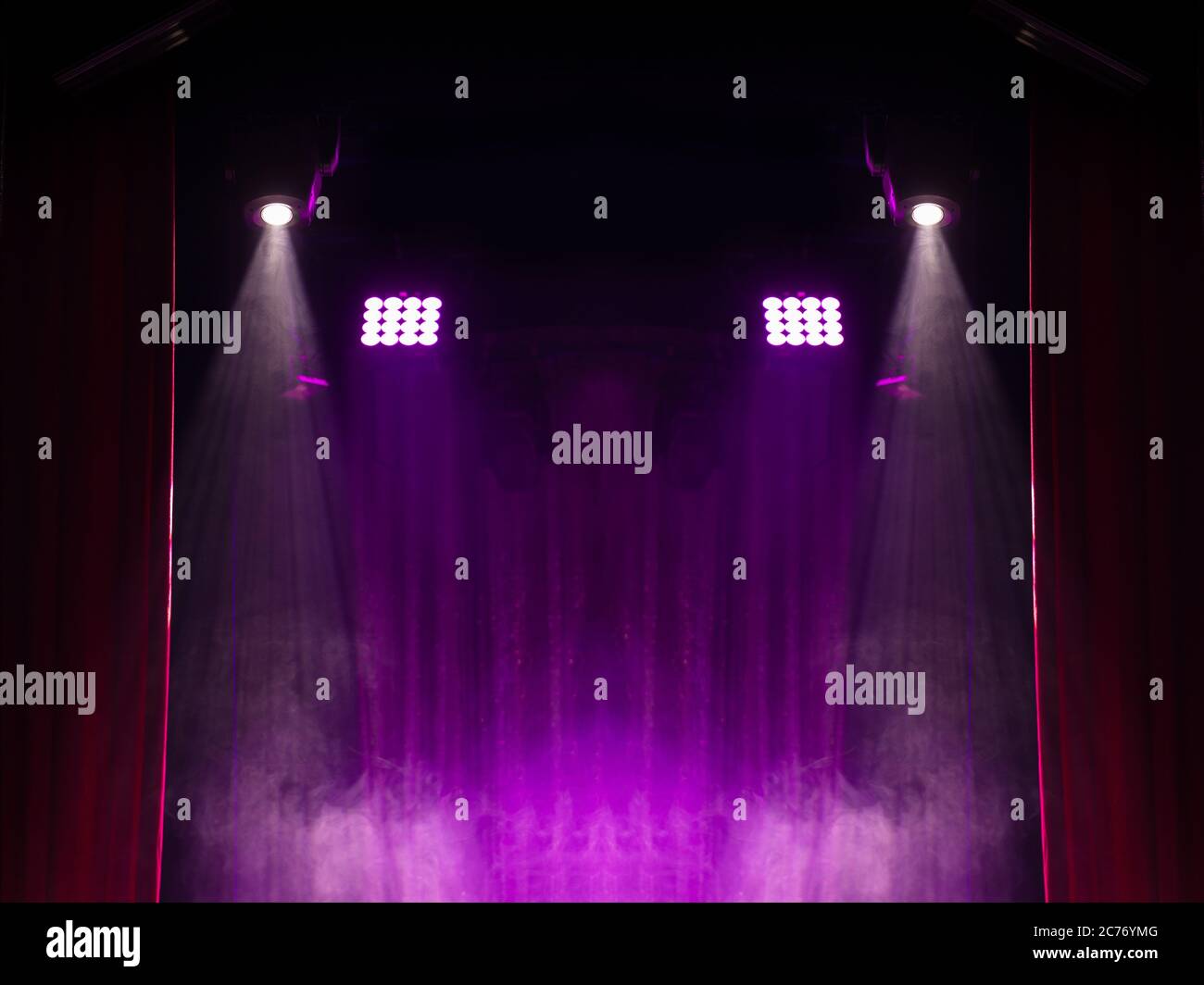 An empty stage of the theater, lit by spotlights and smoke before the ...