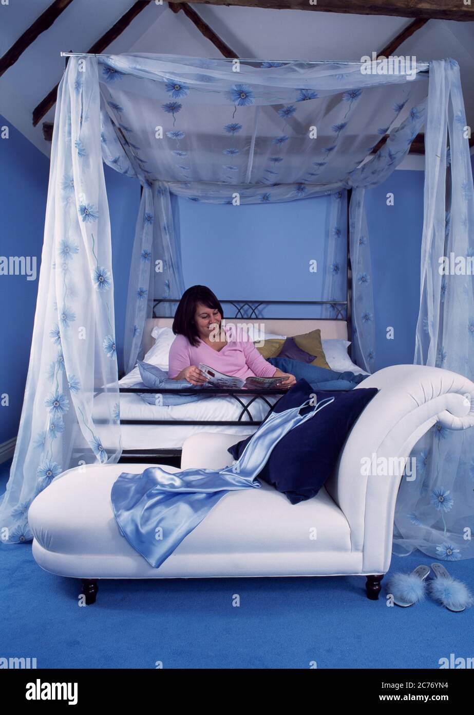 Girl reading magazine on bed hi-res stock photography and images - Alamy