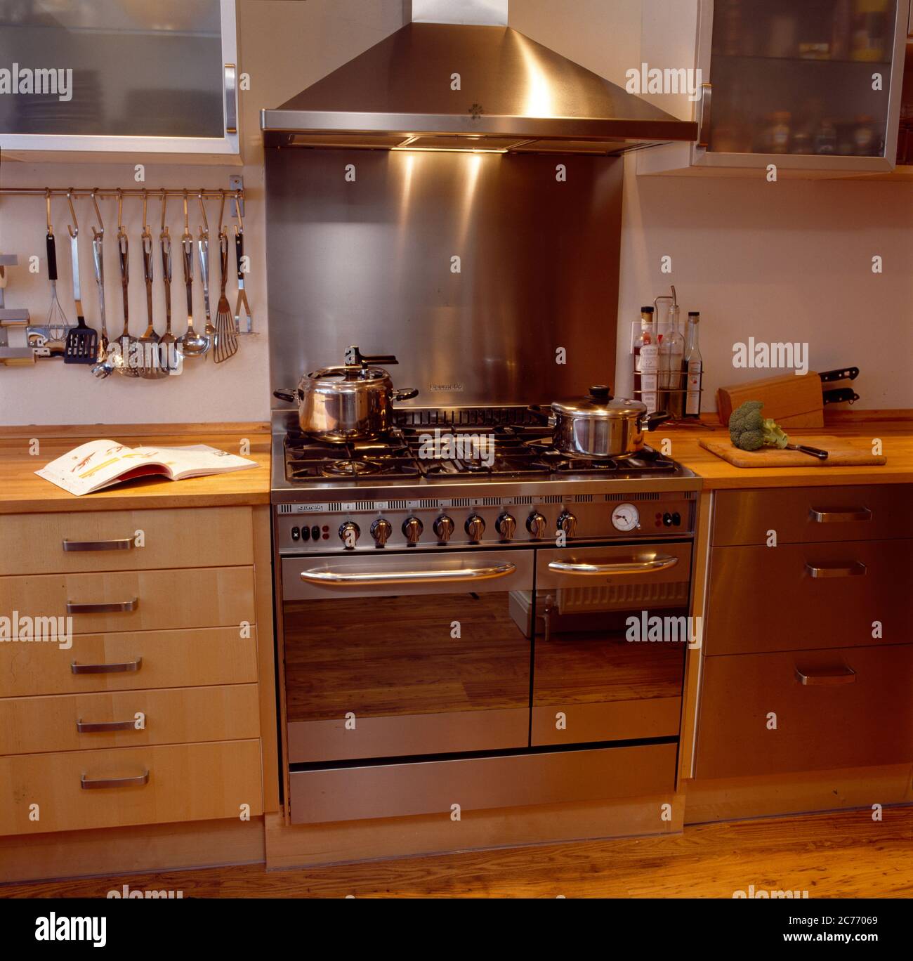 Stainless steel range with extractor Stock Photo - Alamy