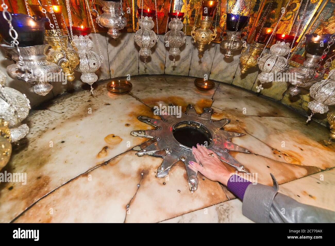 The Grotto of the Nativity, a rectangular alcove beneath the church, is ...