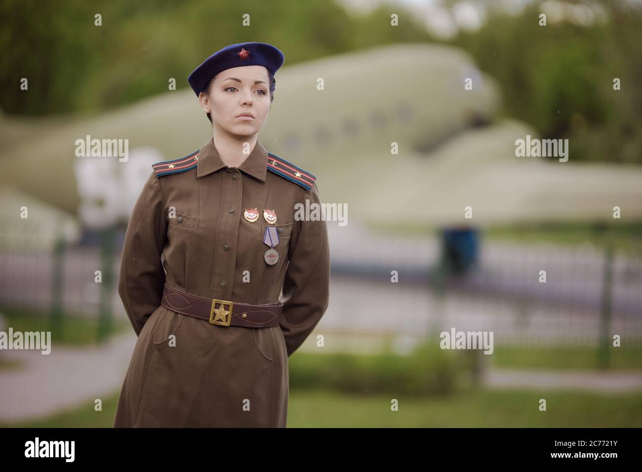 A young female pilot in uniform of Soviet Army pilots during the World ...