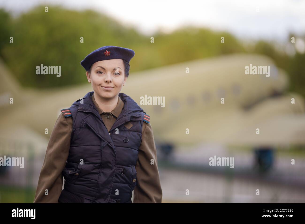 A young female pilot in uniform of Soviet Army pilots during the World ...