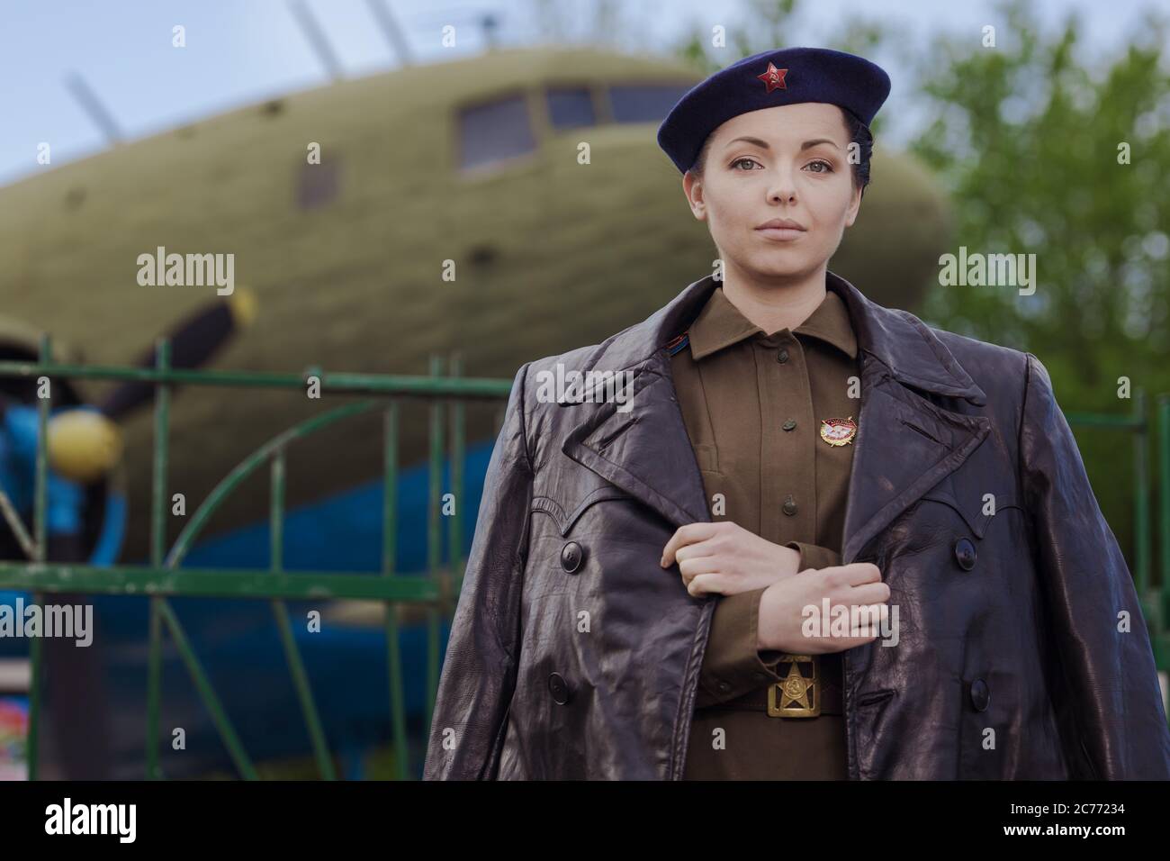 A young female pilot in uniform of Soviet Army pilots during the World ...