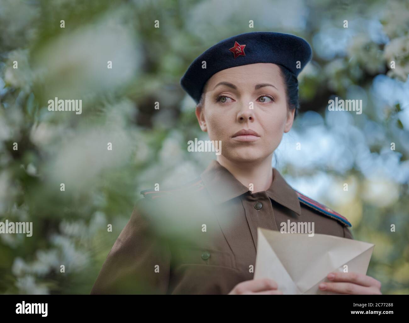 A young female pilot in uniform of Soviet Army pilots during the World ...