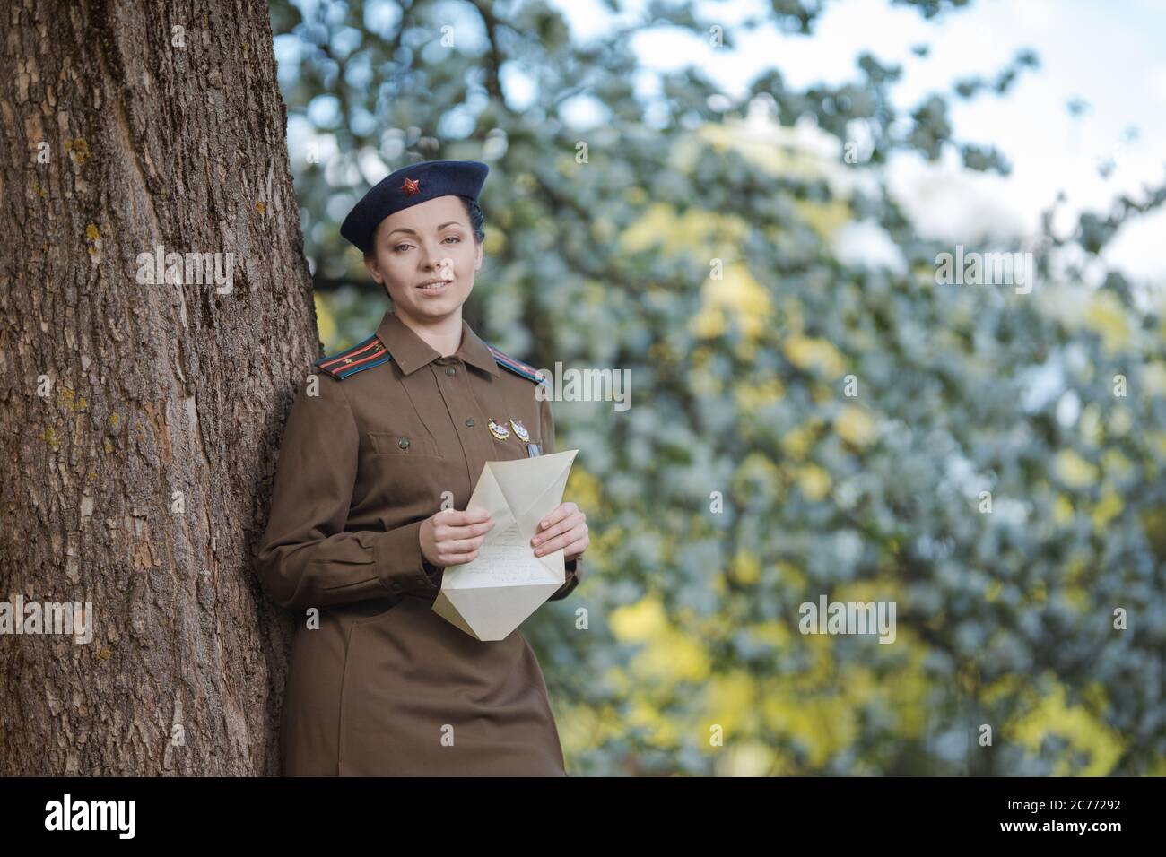 A young female pilot in uniform of Soviet Army pilots during the World ...
