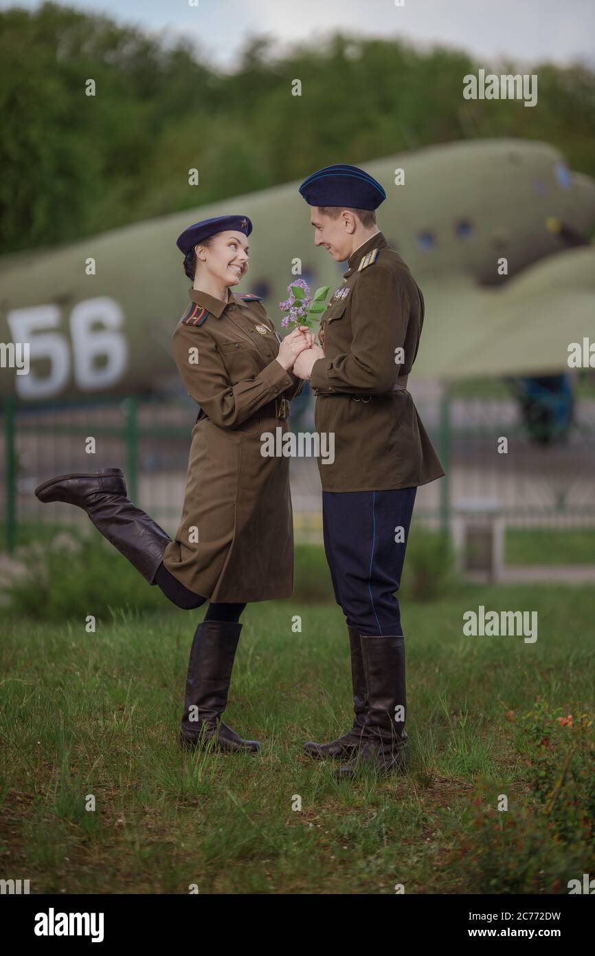Young adult man and woman in the uniform of pilots of the Soviet Army ...
