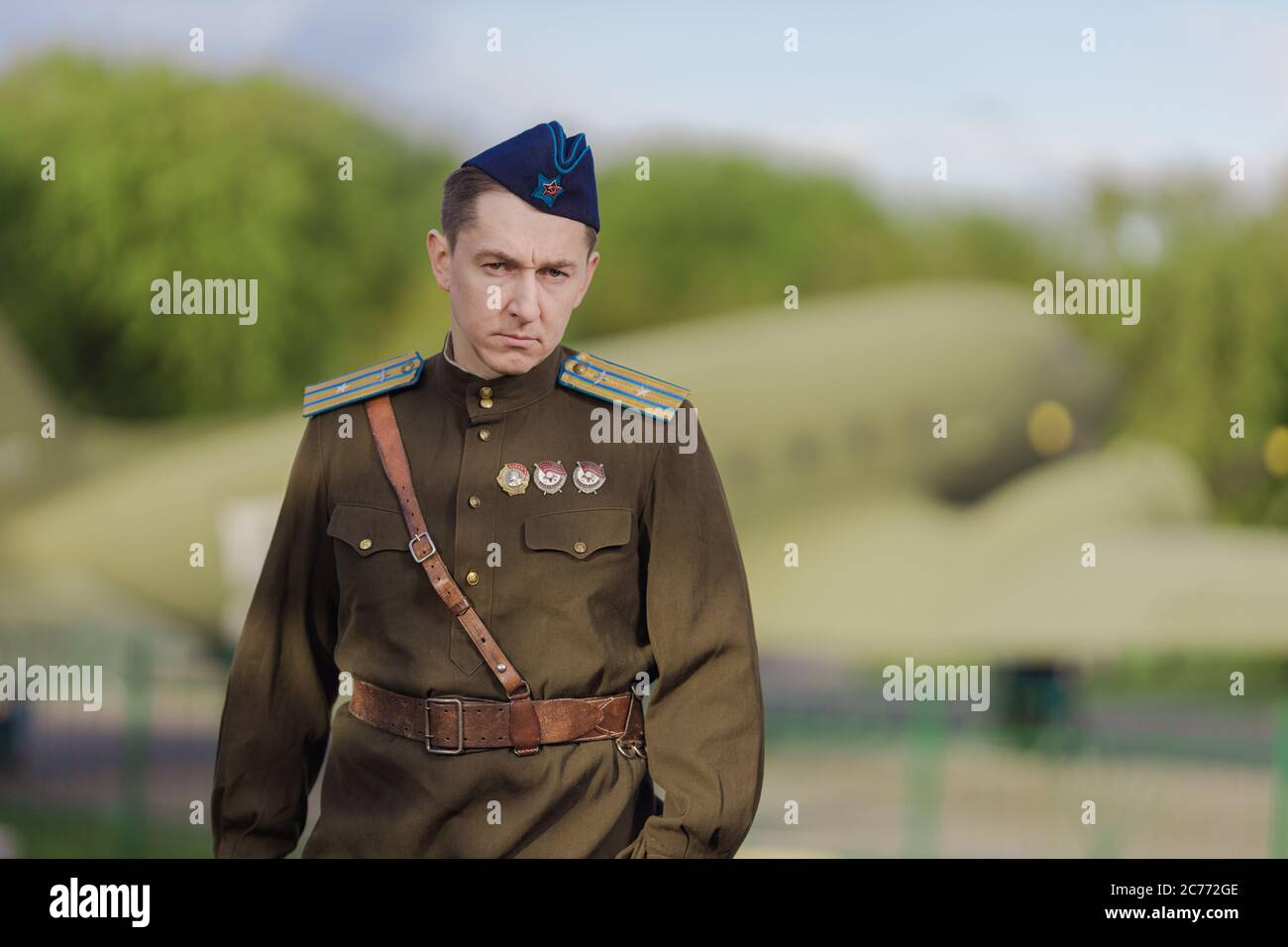 A young adult male pilot in the uniform of pilots of the Soviet Army of ...