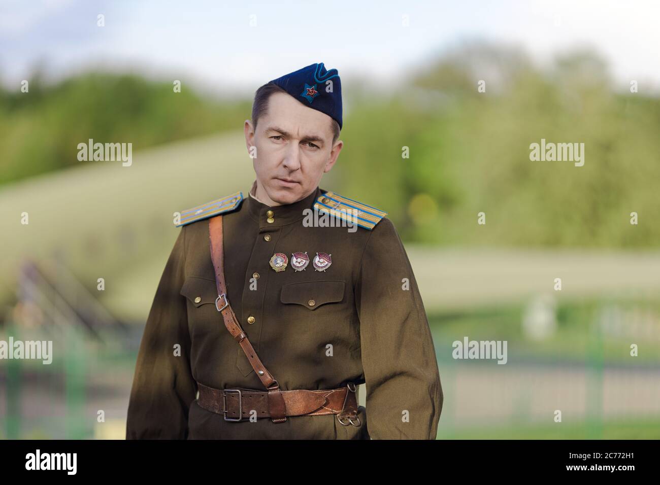 A young adult male pilot in the uniform of pilots of the Soviet Army of ...