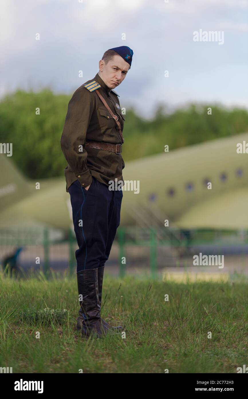 A young adult male pilot in the uniform of pilots of the Soviet Army of ...