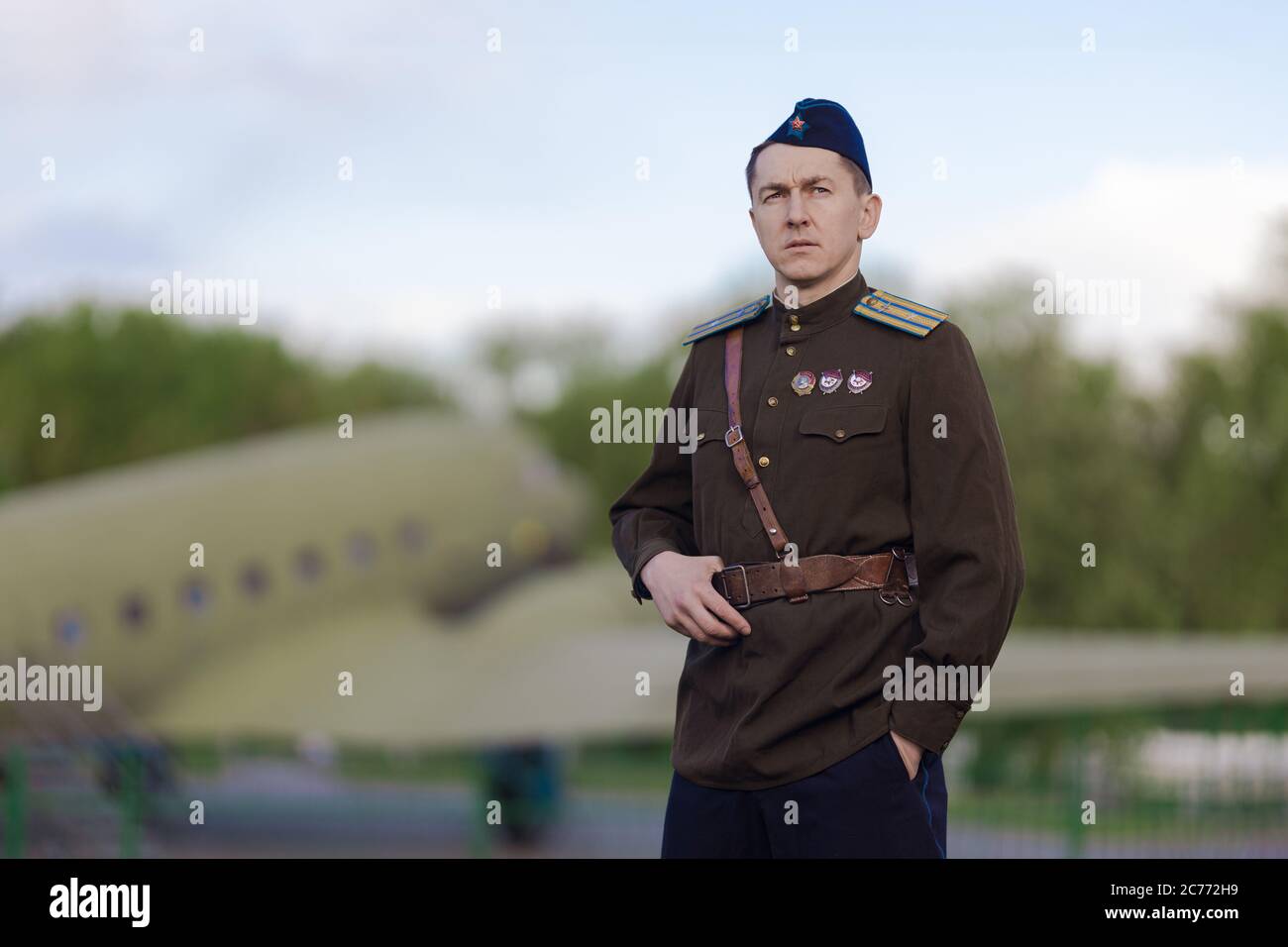 A young adult male pilot in the uniform of pilots of the Soviet Army of ...