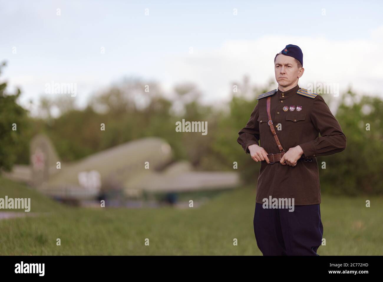 A young adult male pilot in the uniform of pilots of the Soviet Army of ...