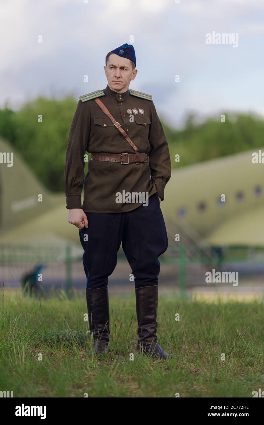 A young adult male pilot in the uniform of pilots of the Soviet Army of ...