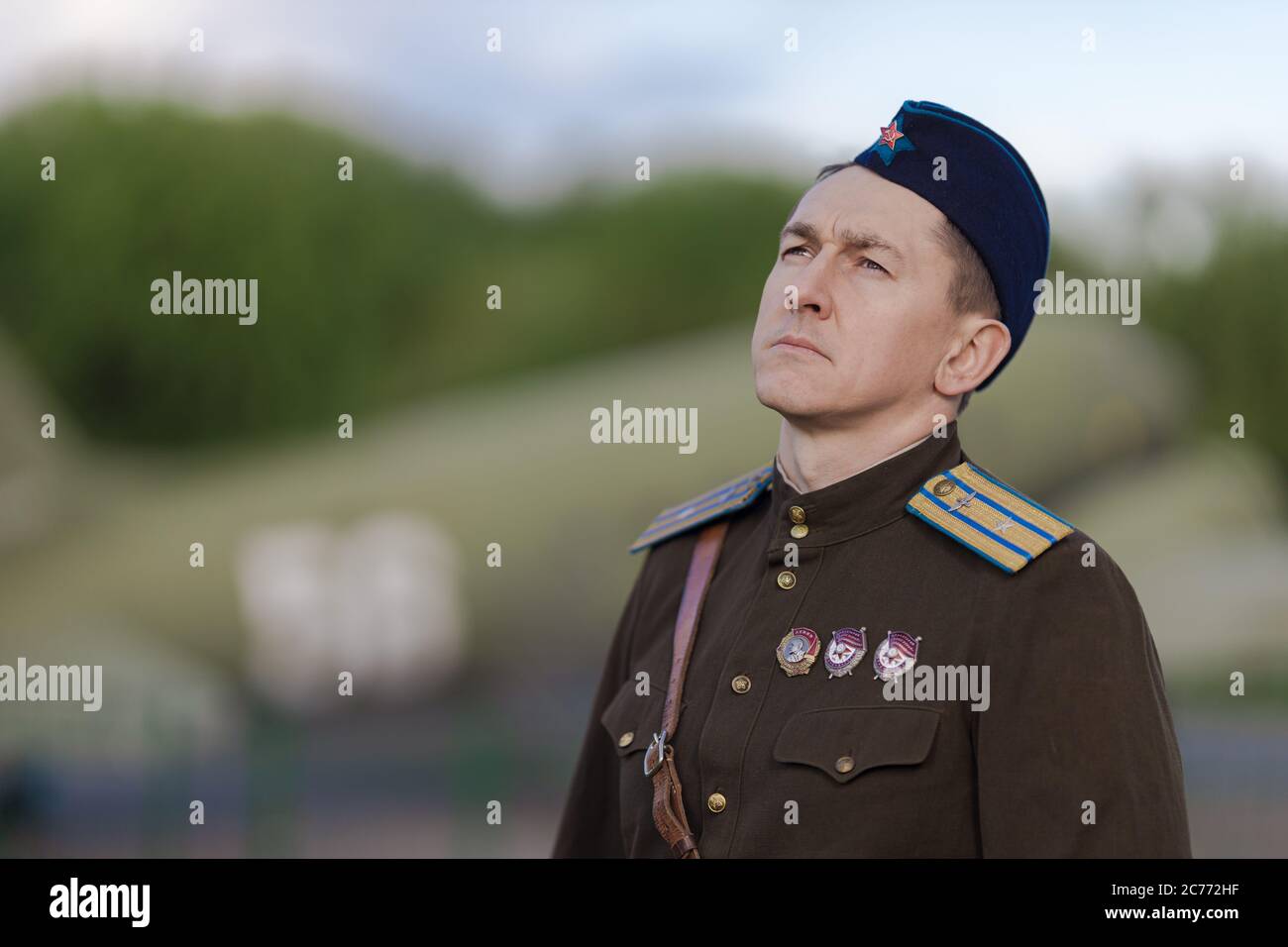 A young adult male pilot in the uniform of pilots of the Soviet Army of ...