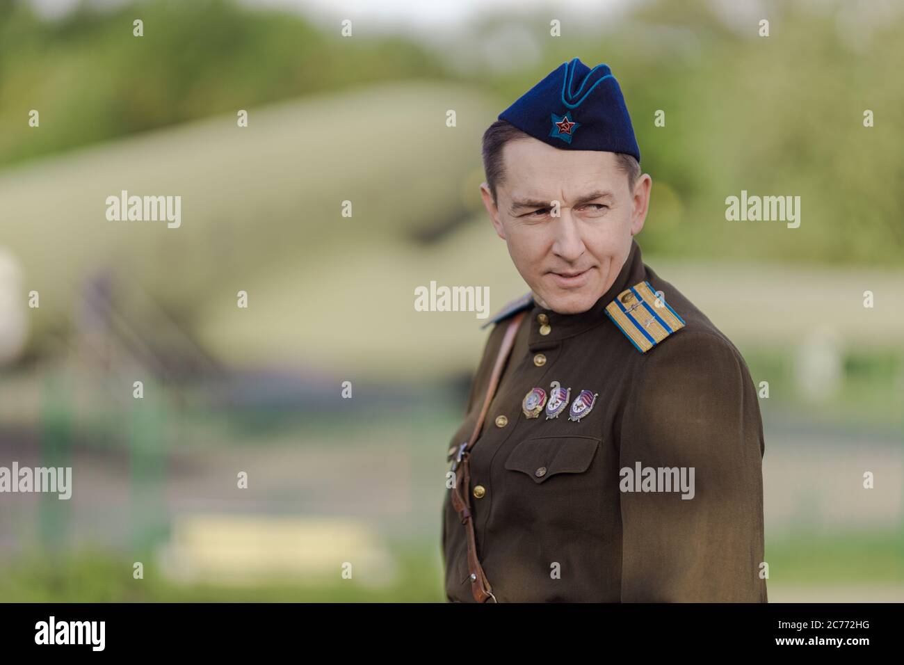 A young adult male pilot in the uniform of pilots of the Soviet Army of ...