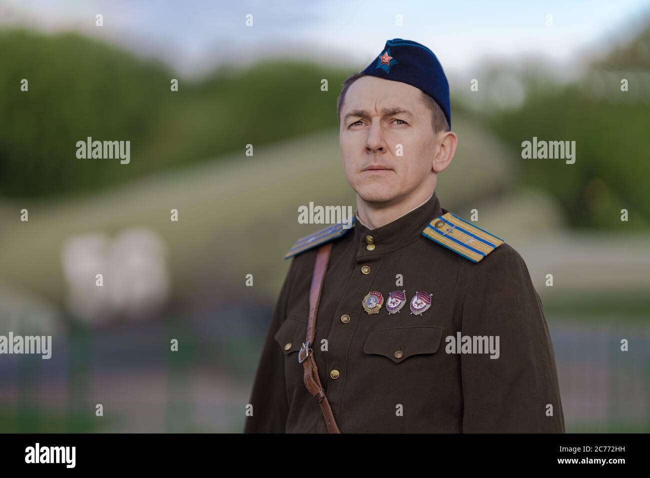 A young adult male pilot in the uniform of pilots of the Soviet Army of ...