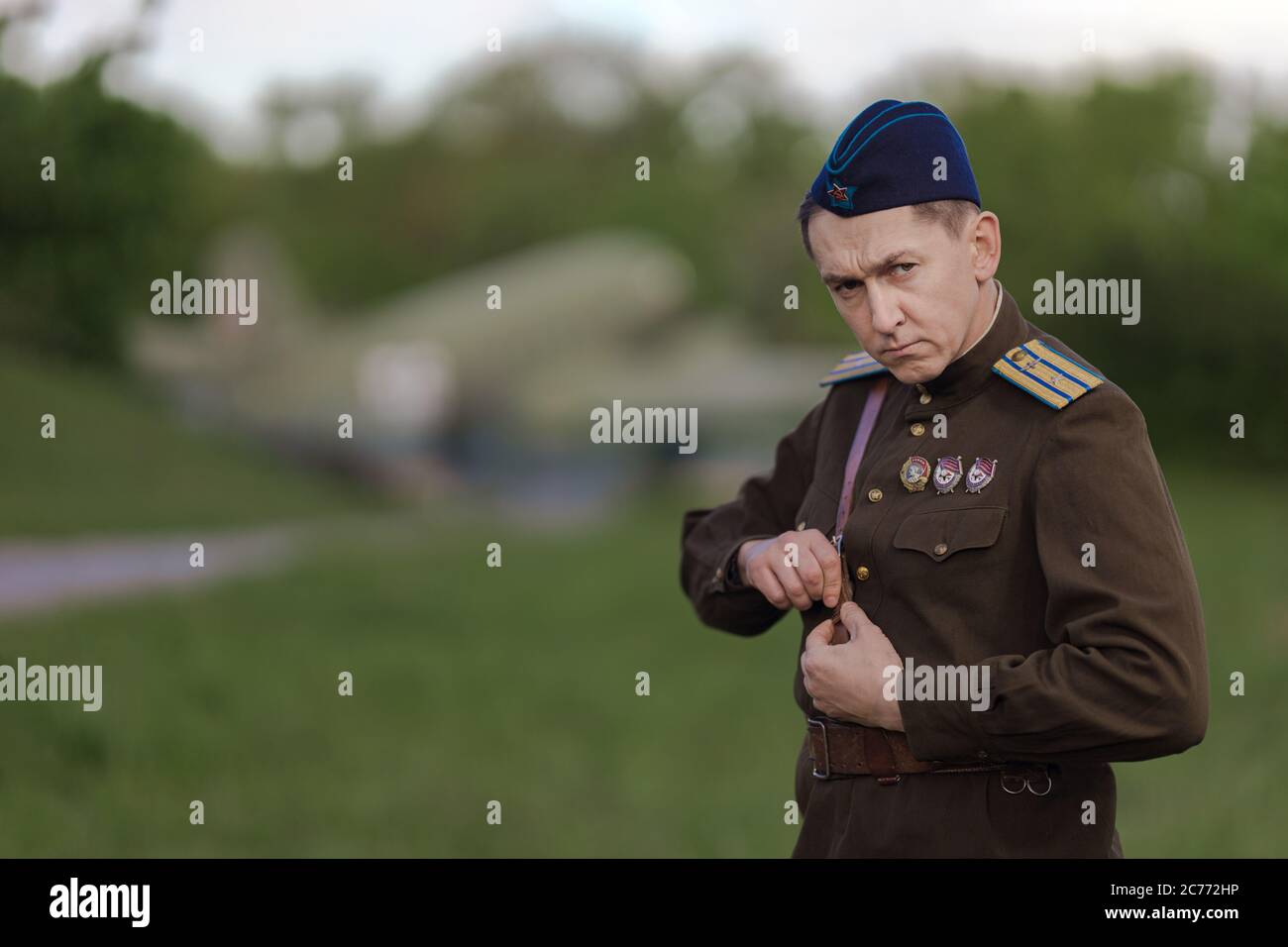 A young adult male pilot in the uniform of pilots of the Soviet Army of ...