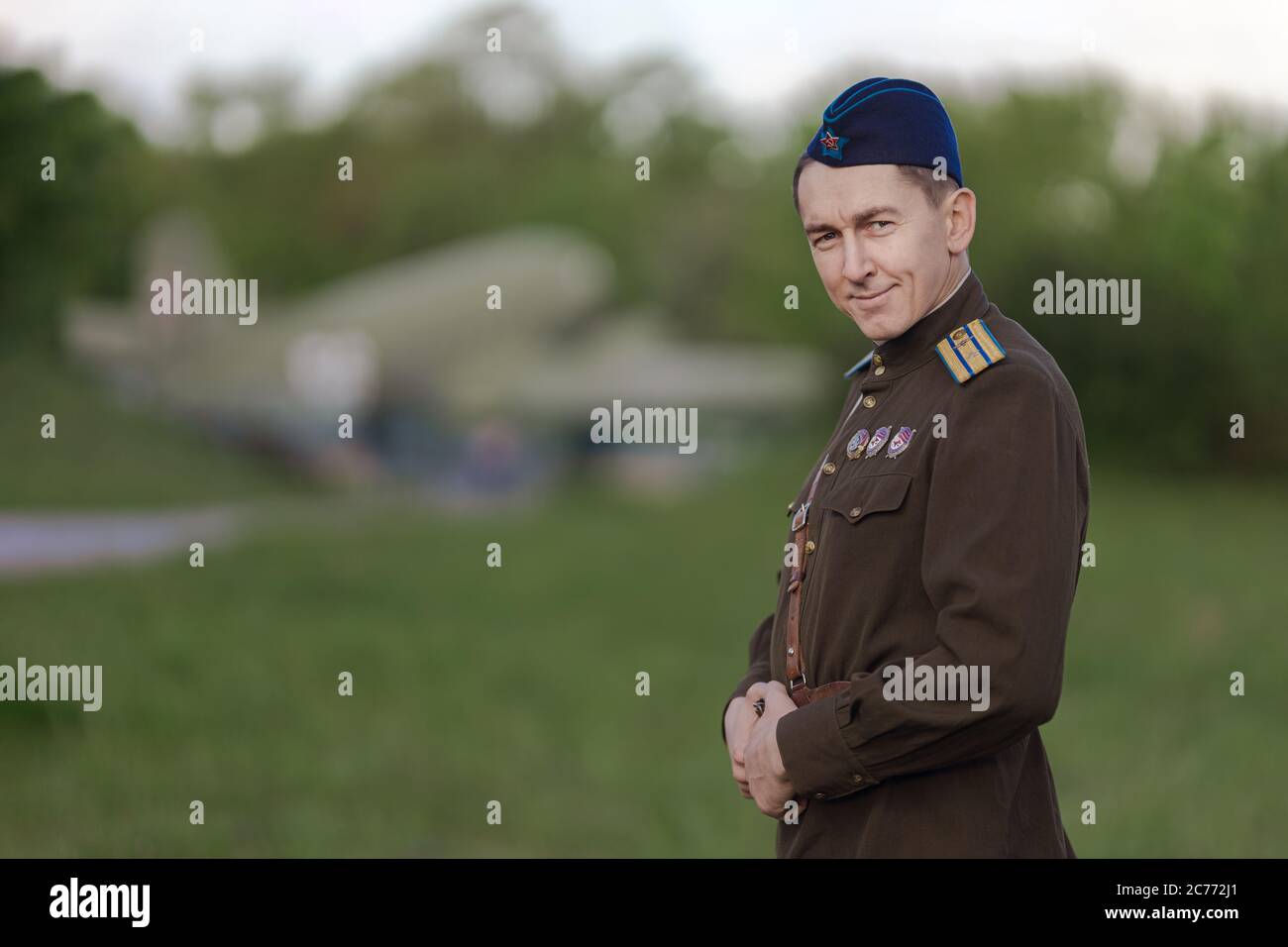 A young adult male pilot in the uniform of pilots of the Soviet Army of ...
