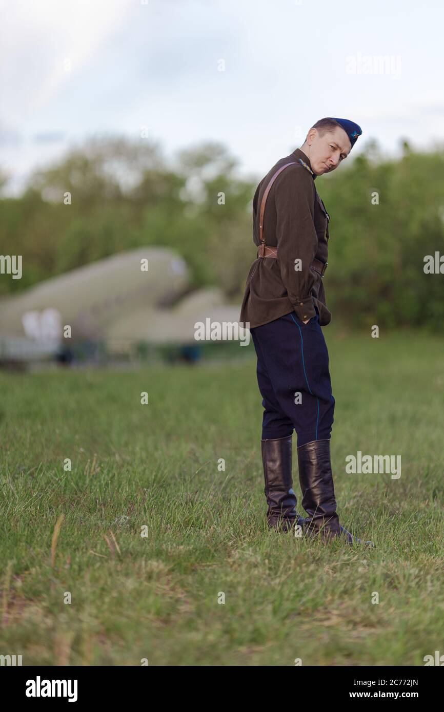 A young adult male pilot in the uniform of pilots of the Soviet Army of ...