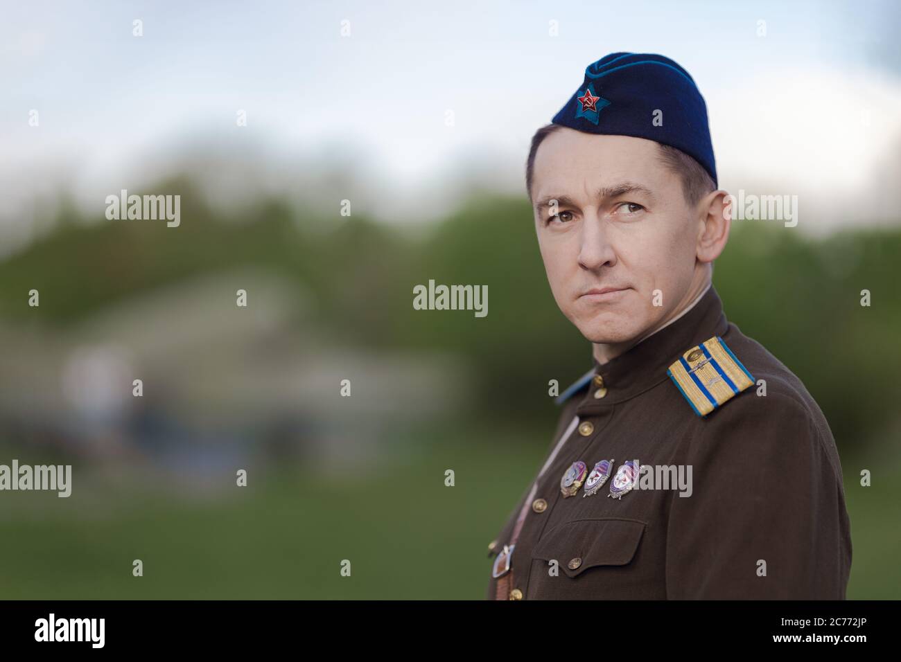 A young adult male pilot in the uniform of pilots of the Soviet Army of ...