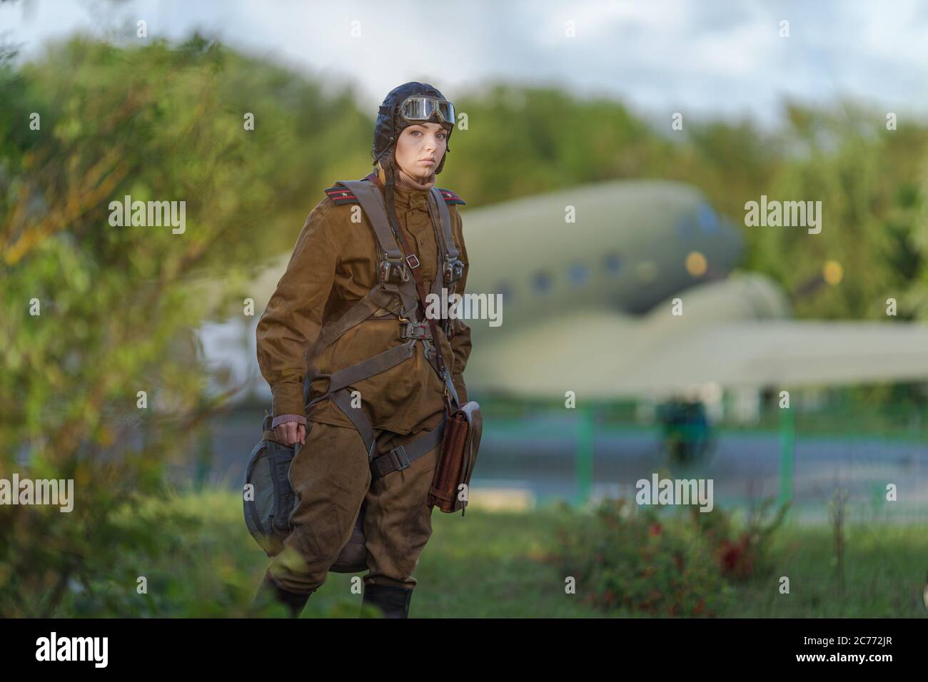 A young female pilot in uniform of Soviet Army pilots during the World ...