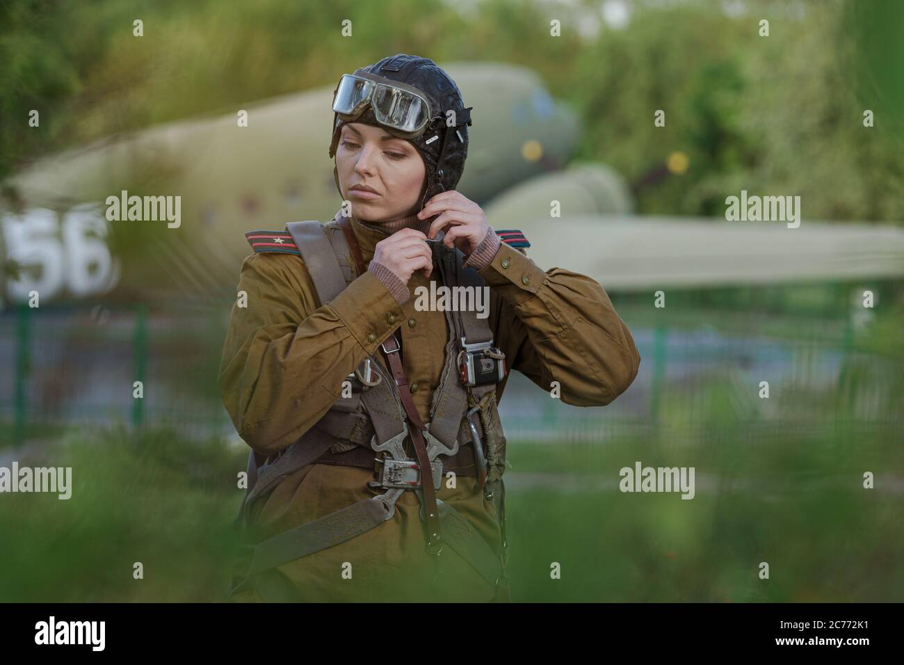 A young female pilot in uniform of Soviet Army pilots during the World ...
