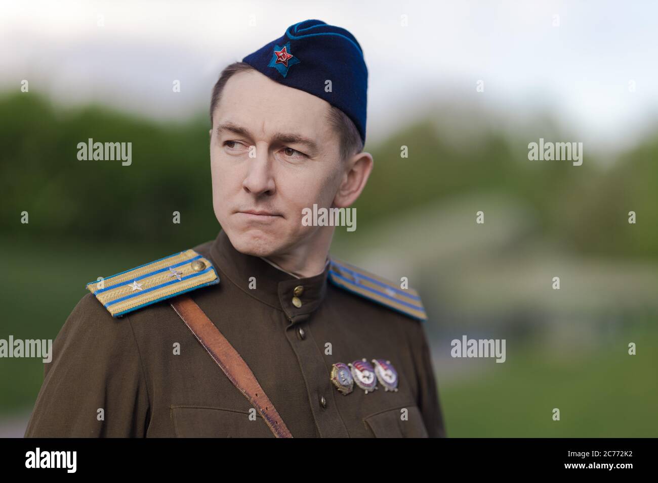A young adult male pilot in the uniform of pilots of the Soviet Army of ...