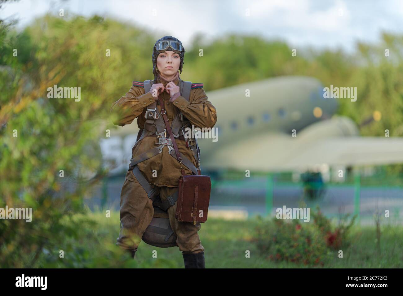 A young female pilot in uniform of Soviet Army pilots during the World ...