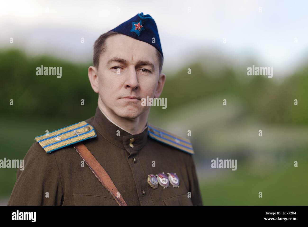 A young adult male pilot in the uniform of pilots of the Soviet Army of ...