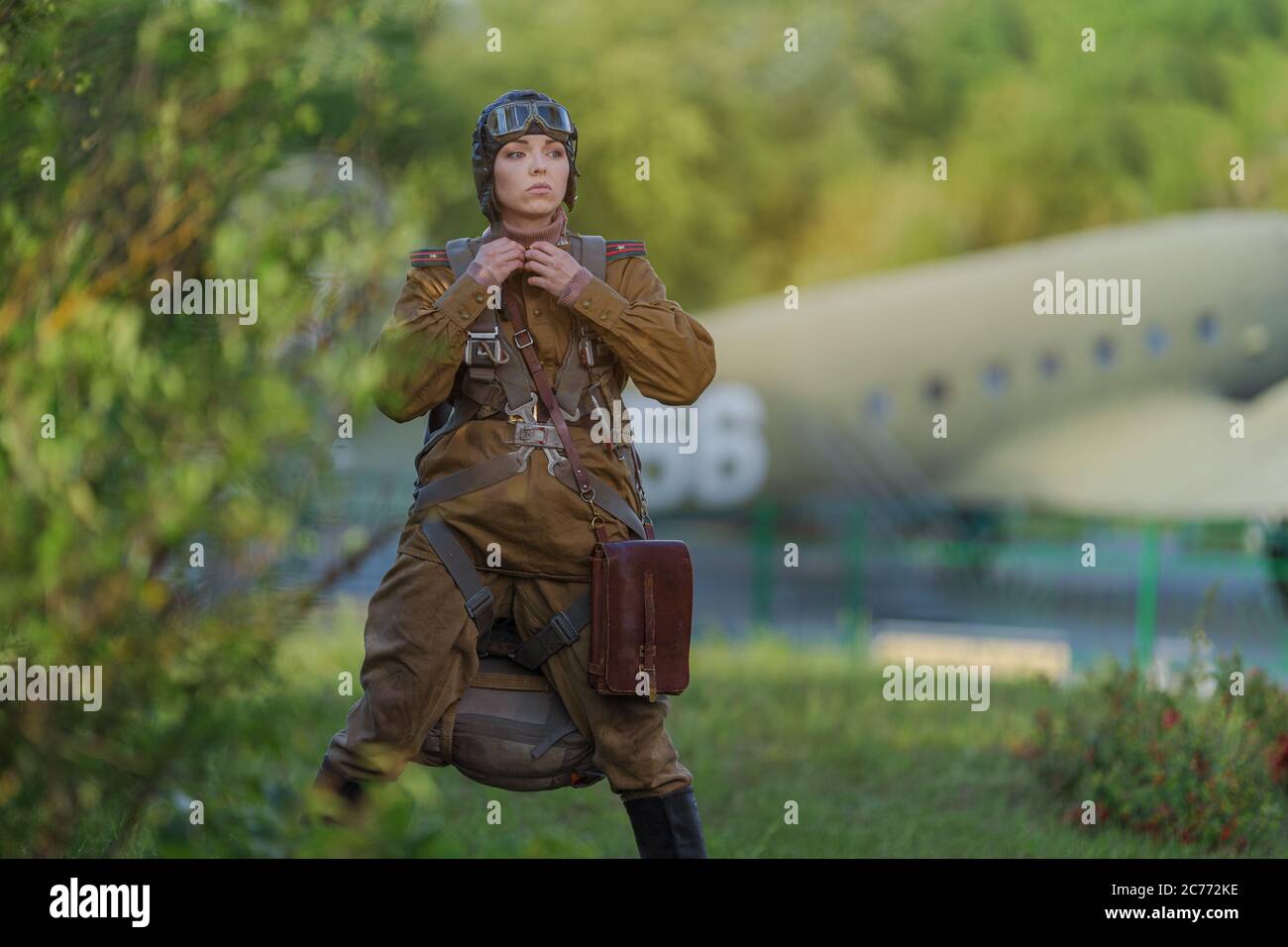 A young female pilot in uniform of Soviet Army pilots during the World ...