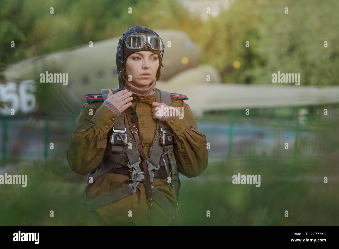 A young female pilot in uniform of Soviet Army pilots during the World ...