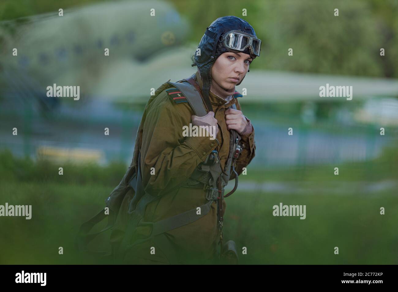 A young female pilot in uniform of Soviet Army pilots during the World ...