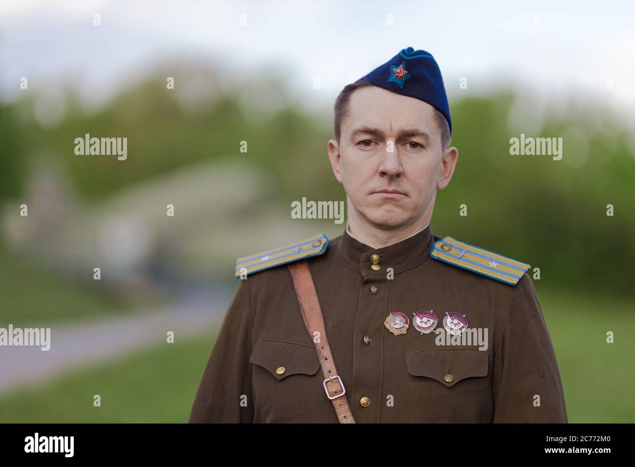 A young adult male pilot in the uniform of pilots of the Soviet Army of ...