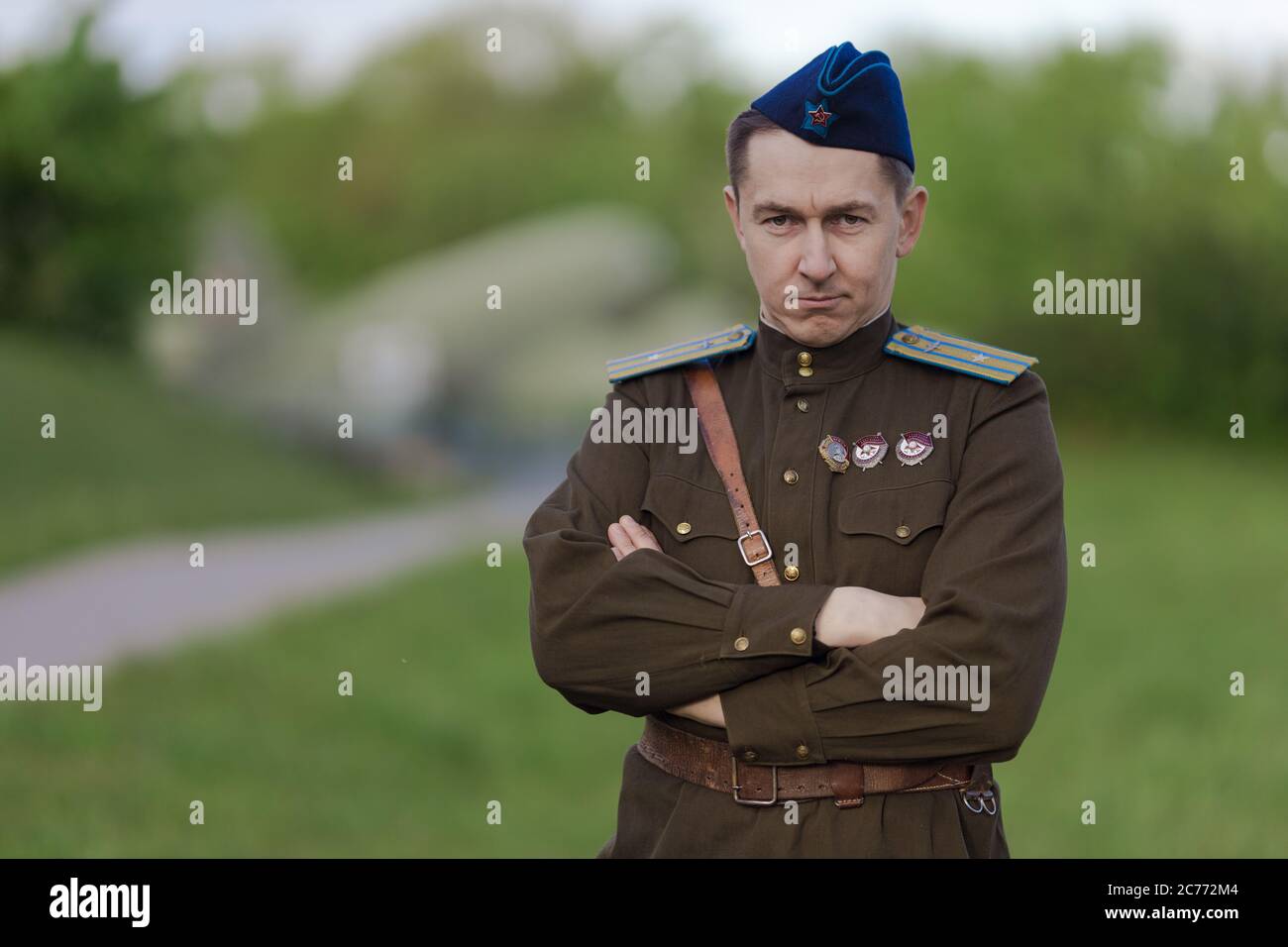 A young adult male pilot in the uniform of pilots of the Soviet Army of ...