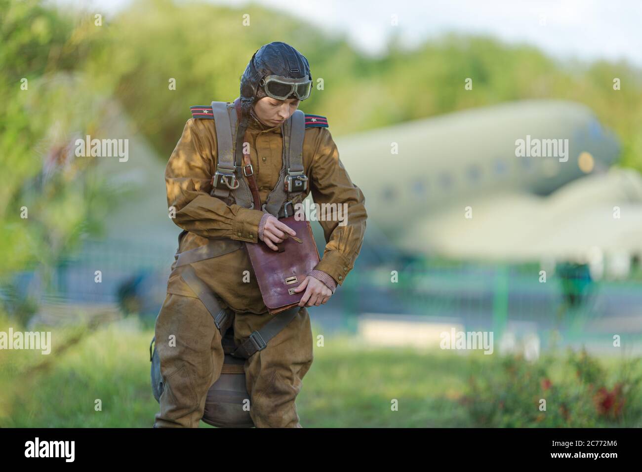 A young female pilot in uniform of Soviet Army pilots during the World ...