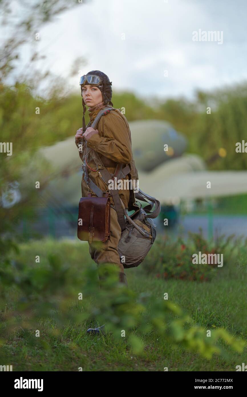 A young female pilot in uniform of Soviet Army pilots during the World ...