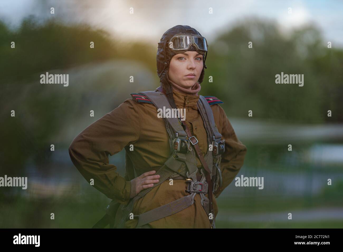 A young female pilot in uniform of Soviet Army pilots during the World ...