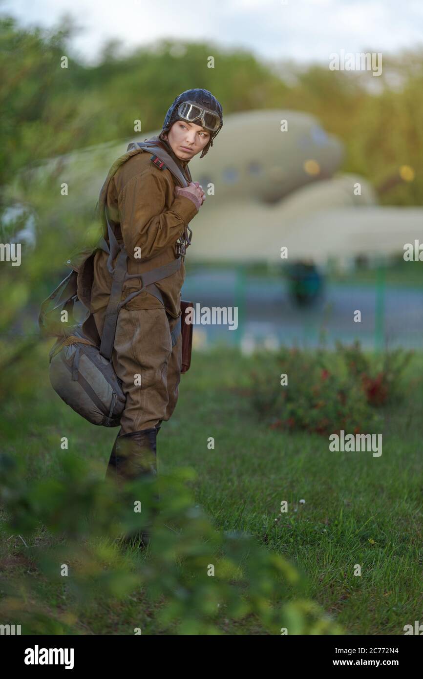A young female pilot in uniform of Soviet Army pilots during the World ...