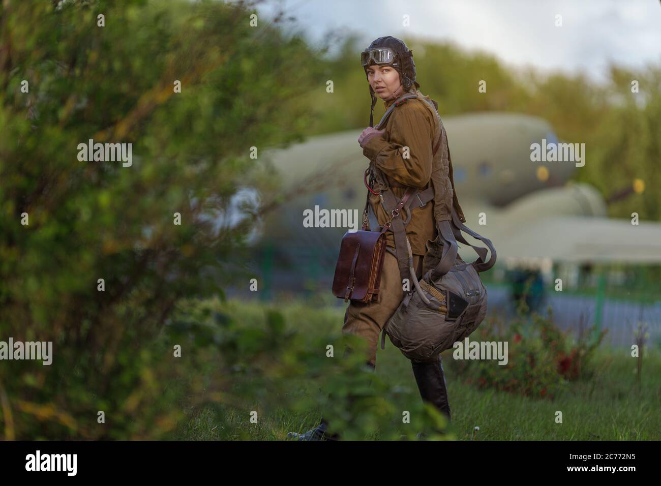 A young female pilot in uniform of Soviet Army pilots during the World ...