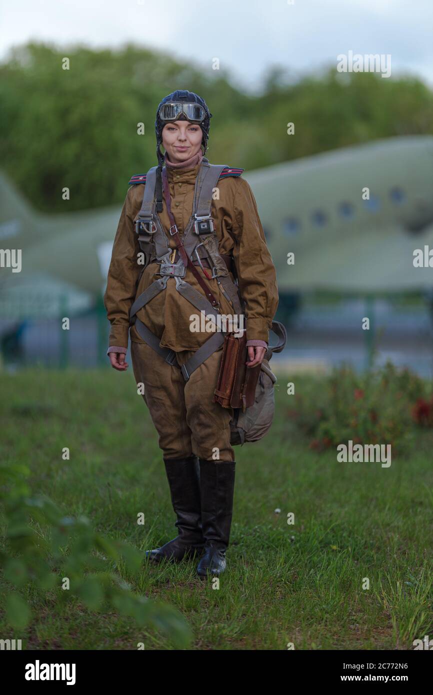 A young female pilot in uniform of Soviet Army pilots during the World ...