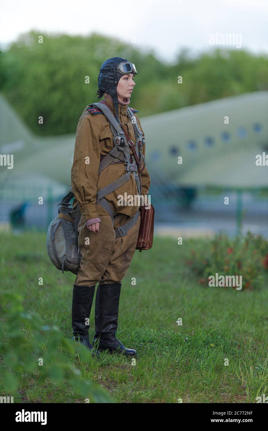 A young female pilot in uniform of Soviet Army pilots during the World ...