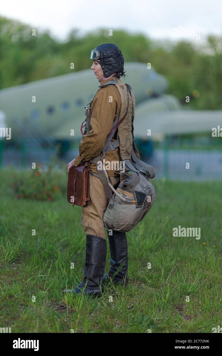 A young female pilot in uniform of Soviet Army pilots during the World ...